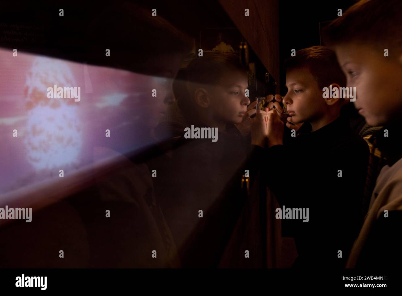 Moscow, Russia. 8th of January, 2024.Visitors watch a video of a ...