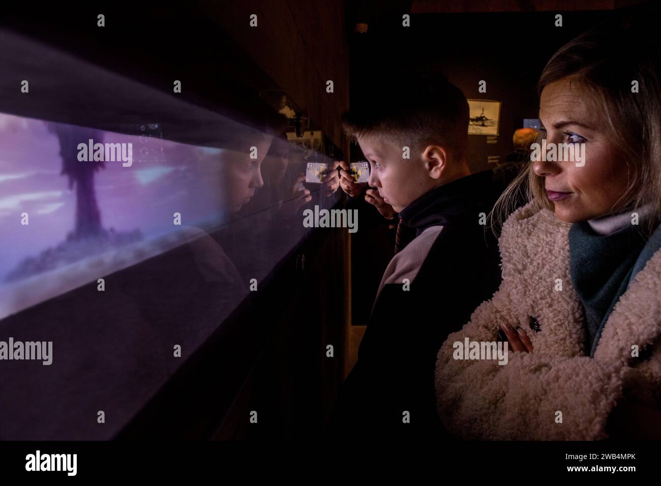 Moscow, Russia. 8th of January, 2024.Visitors watch a video of a ...