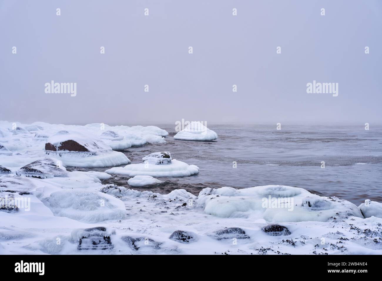 A scenic beach landscape featuring large chunks of ice strewn across ...