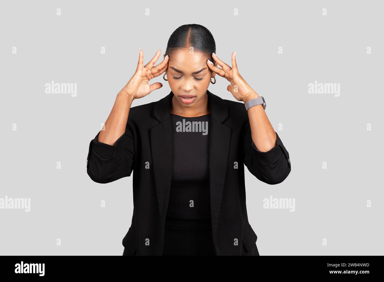 Stressed African American businesswoman in professional attire touches ...