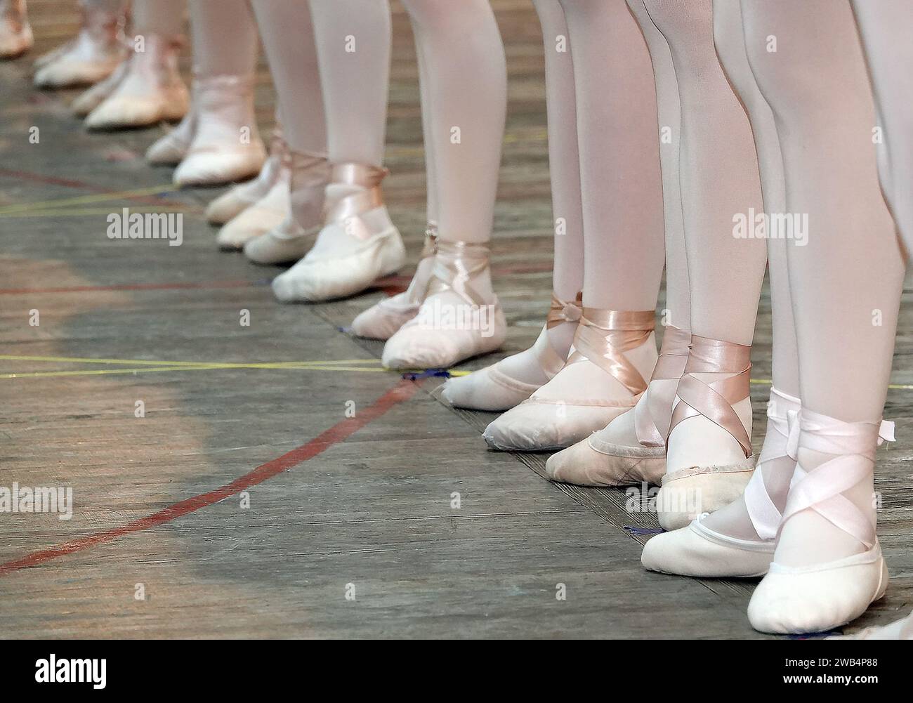 Children's feet in pointe shoes, class in a children's ballet studio ...