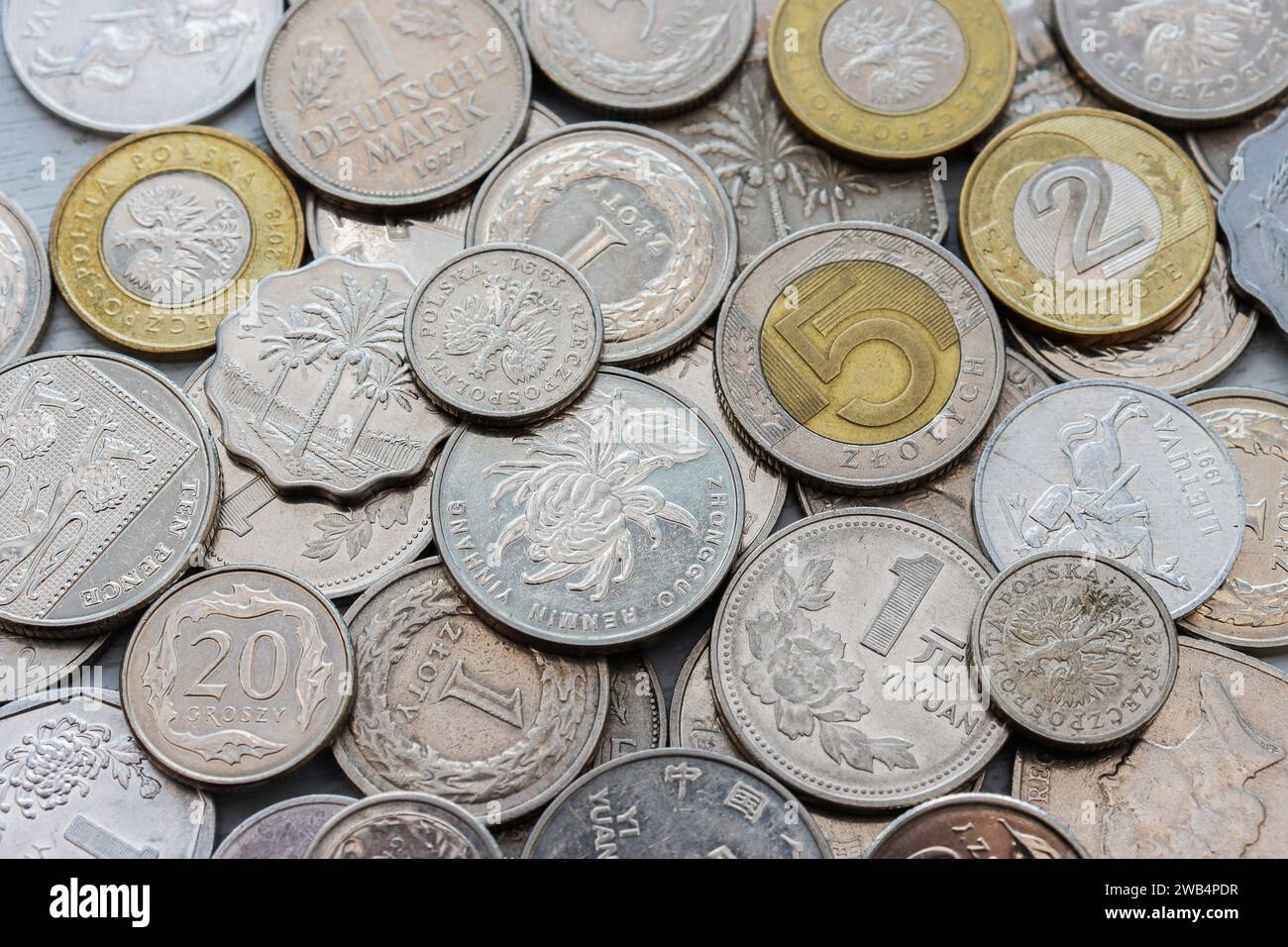 Many different coins, different denominations and colors, top view ...