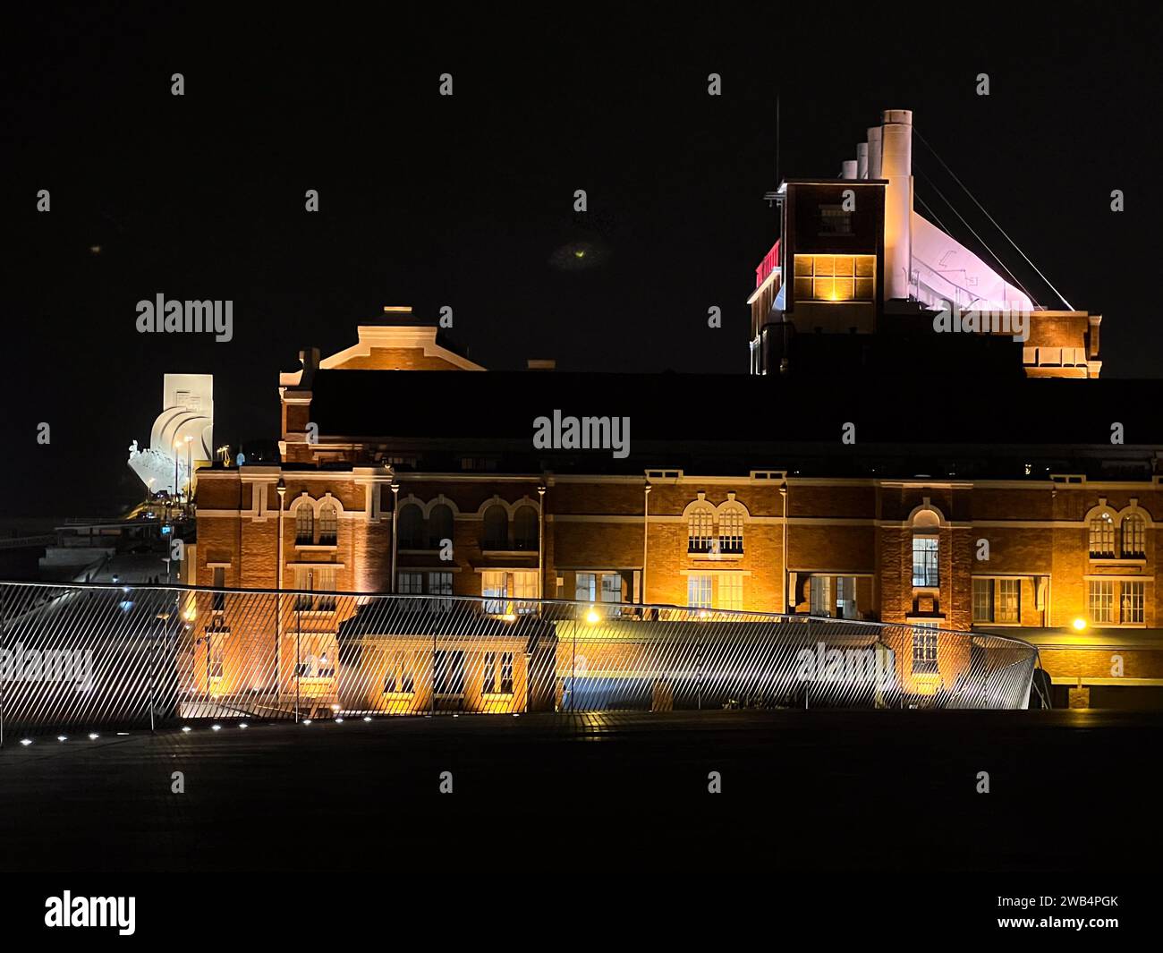 Central Tejo power plant seen at night with Discoverires Monument in ...