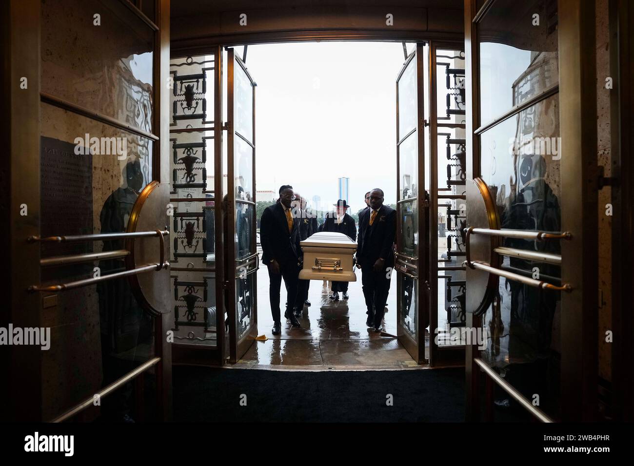 Pallbearers hold the casket carrying former U.S. Rep. Eddie Bernice ...