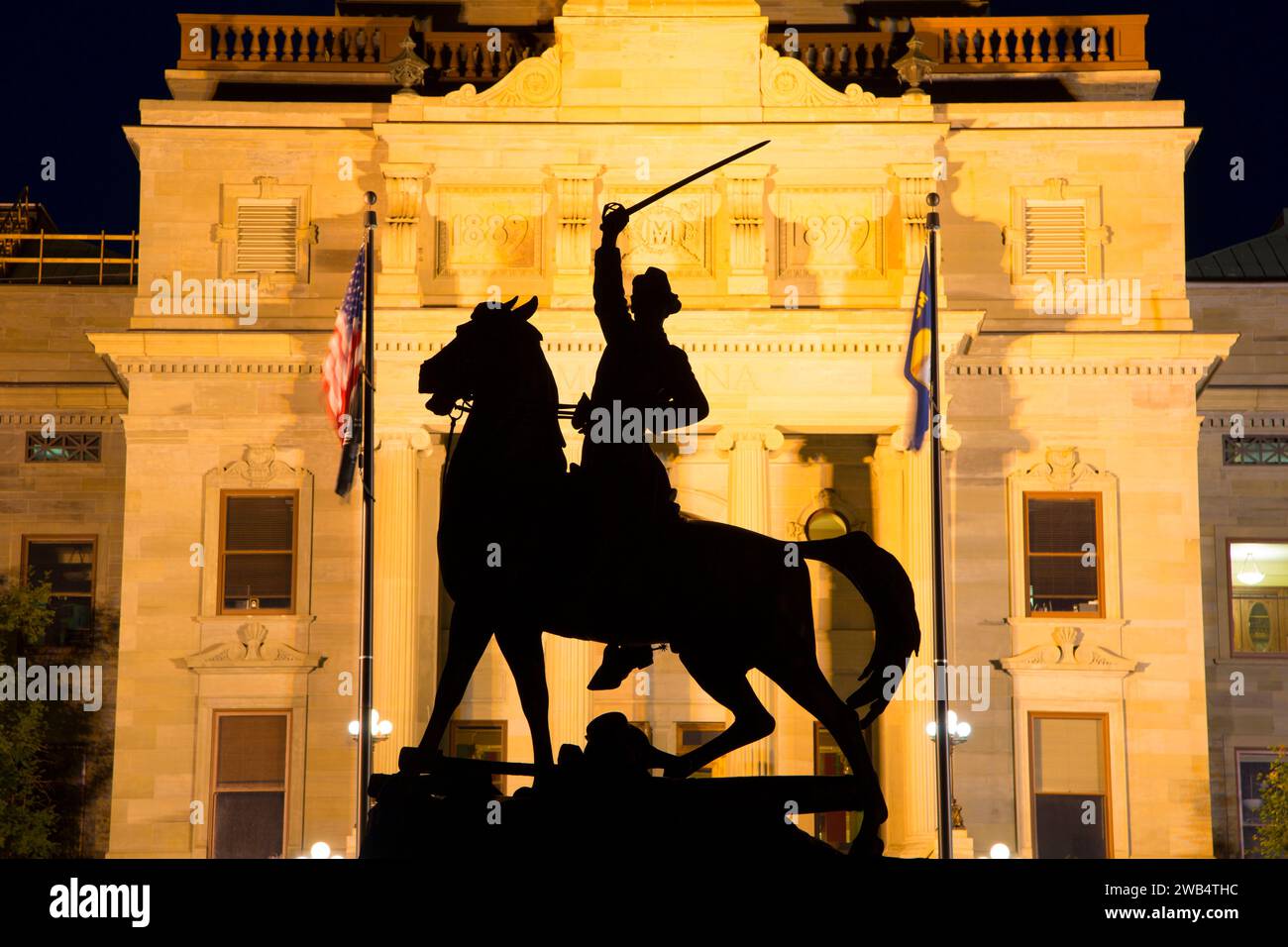 Thomas Francis Meagher statue with capitol at night, Montana State ...