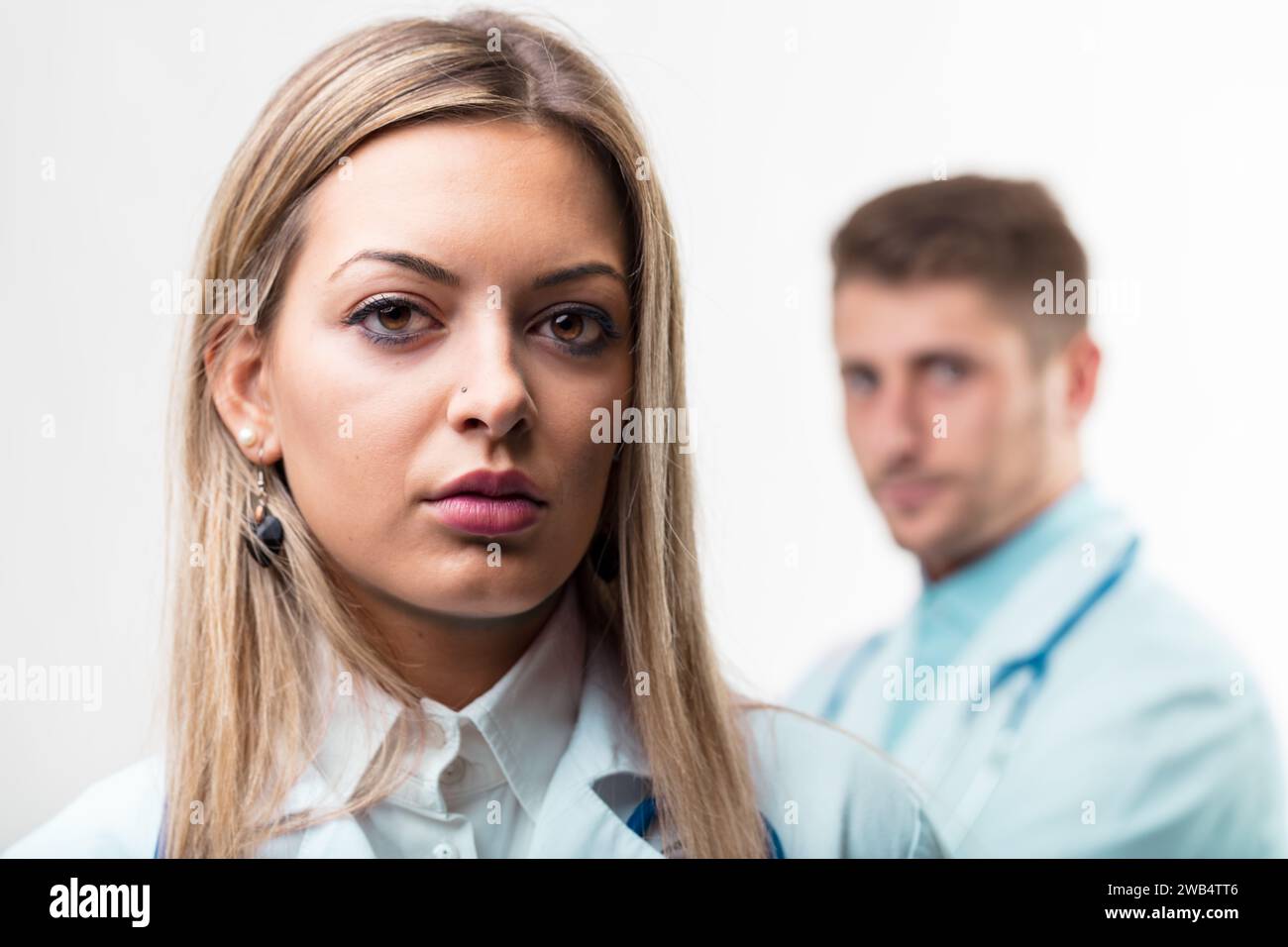 woman's piercing look stands out against the softened figure of a man ...