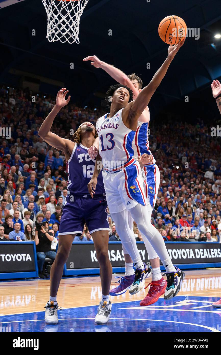 Kansas guard Elmarko Jackson (13) goes up for a rebound in front of TCU ...