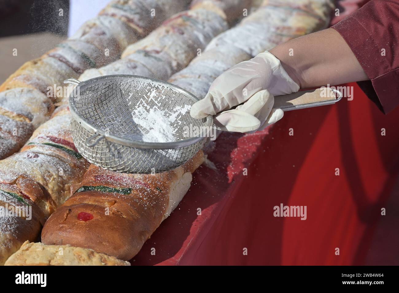 Tijuana, Mexico. 06th Jan, 2024. A piece of Kings bread being covered ...