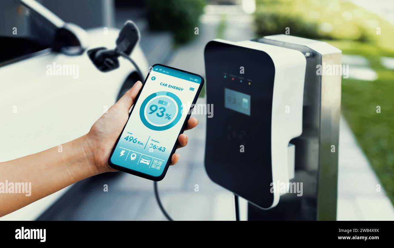 Smartphone display battery status on smart EV mobile application while ...