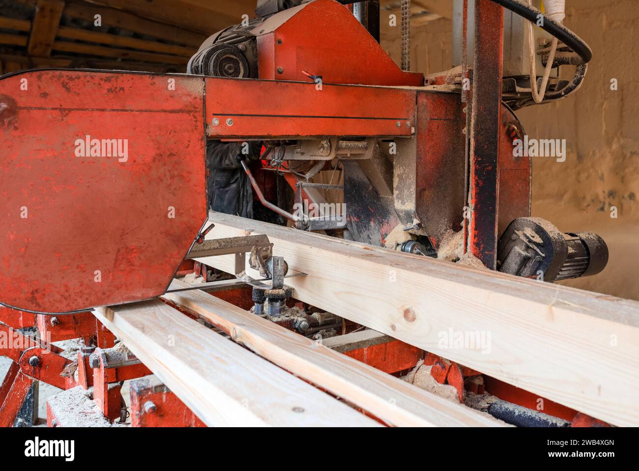 Processing wooden boards at a sawmill. The process of processing logs ...