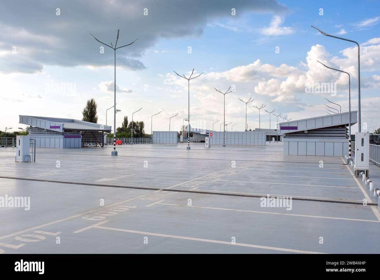 Empty open parking lot for cars on the background of the sky. Empty ...