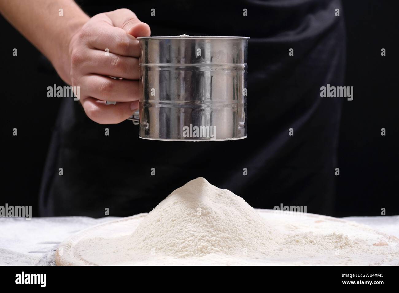 Sifting grain through sieve hi-res stock photography and images - Alamy