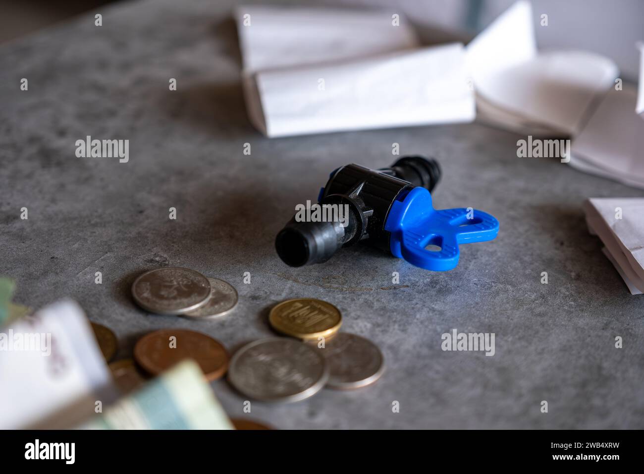 Shut valve with bills and cash on each side of the valve represents the ...