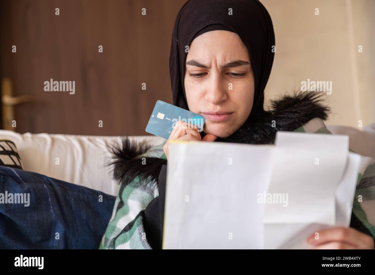 Woman feeling frustrated due to bill amount and living costs while ...