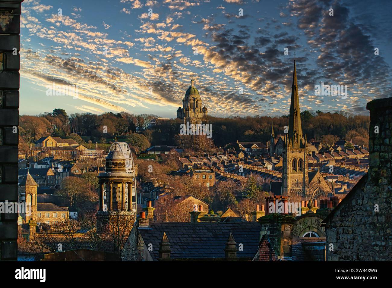 Historic cityscape at sunset with dramatic clouds, showcasing ...