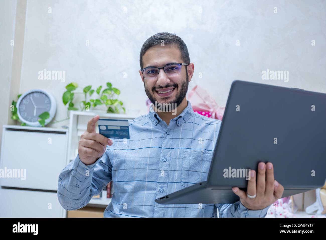 Holding debit card hi-res stock photography and images - Alamy