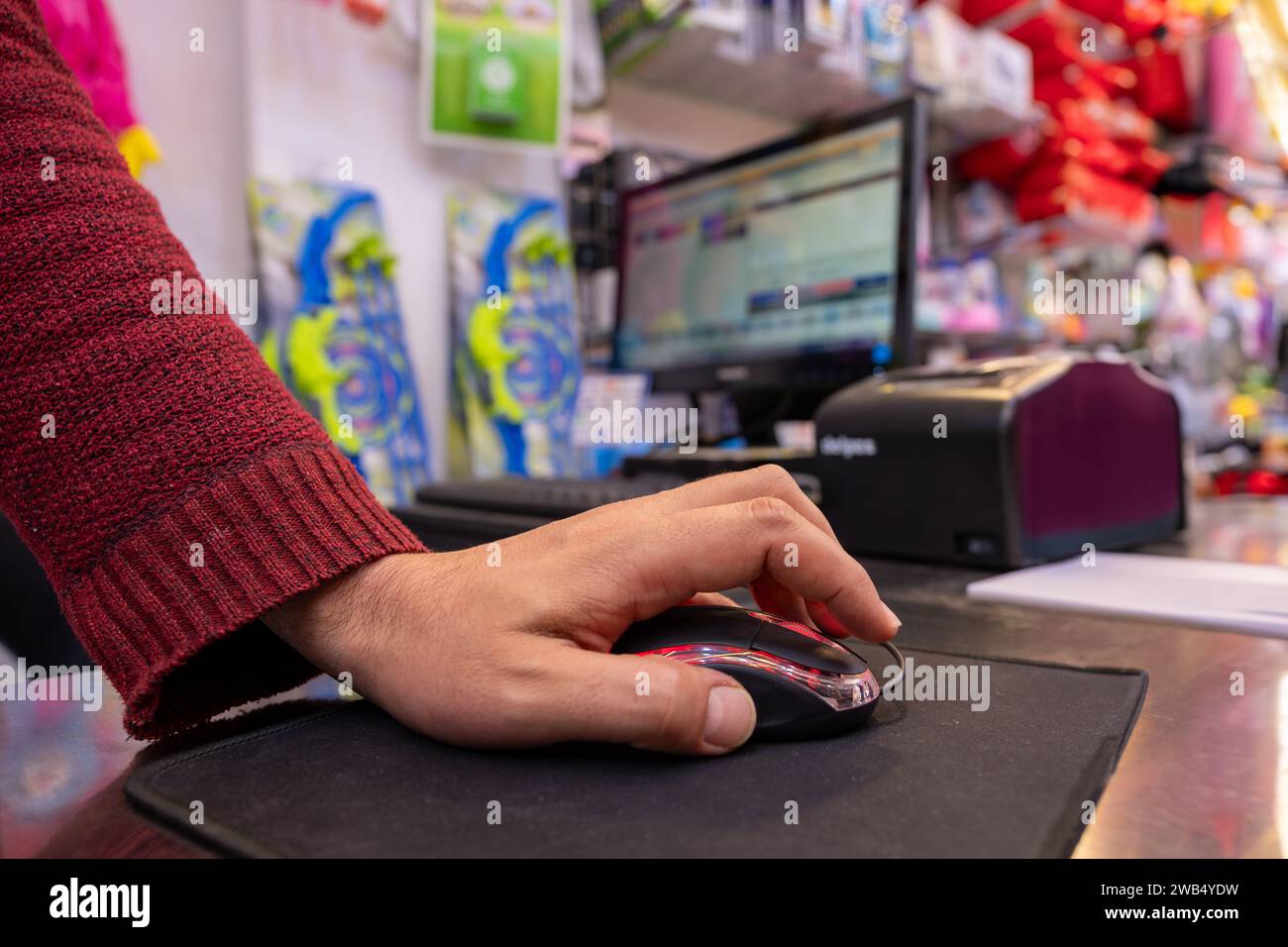 Shop owner hand in store with cashier screen in the background Stock ...