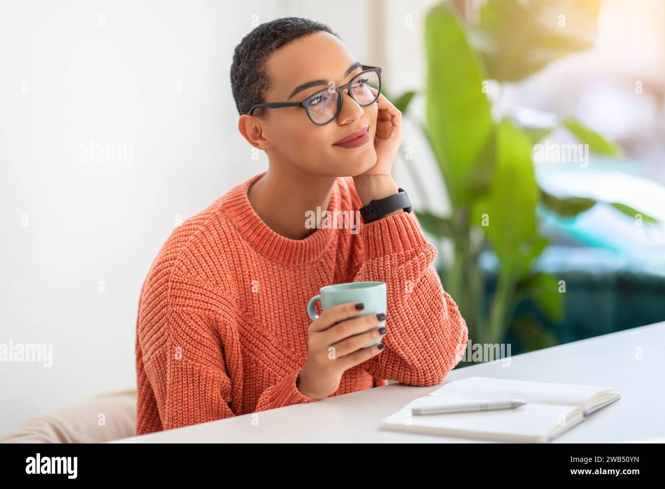 Positive calm young latin woman in glasses enjoy peace and free time ...