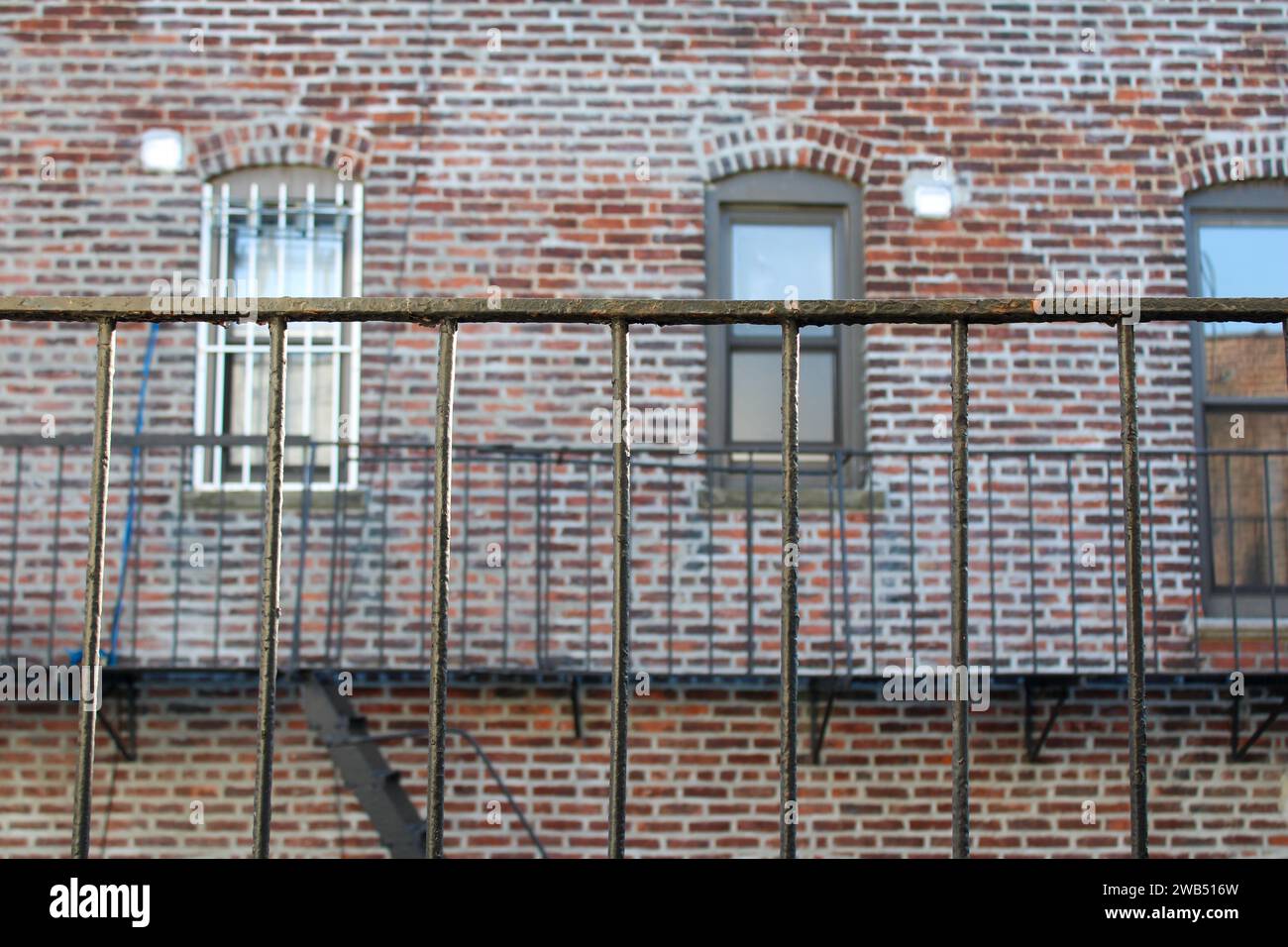 An ornate red brick building with intricate detailing and a series of ...