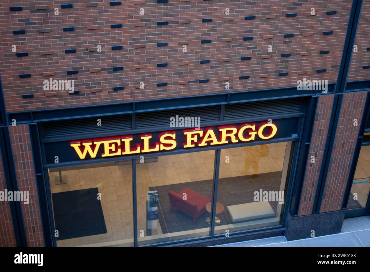 A Wells Fargo logo prominently displayed in the window of a commercial ...