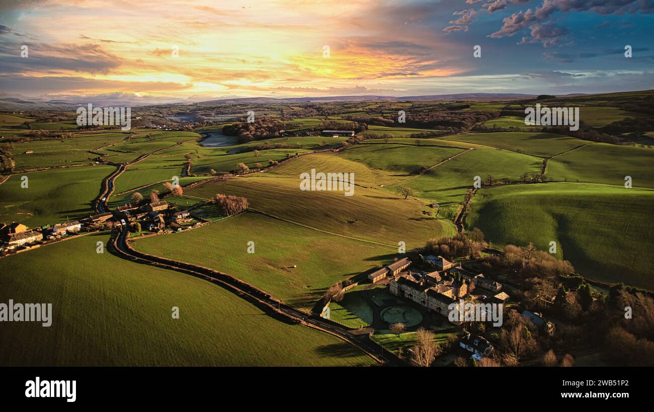 Aerial view of a picturesque rural landscape at sunset with rolling ...