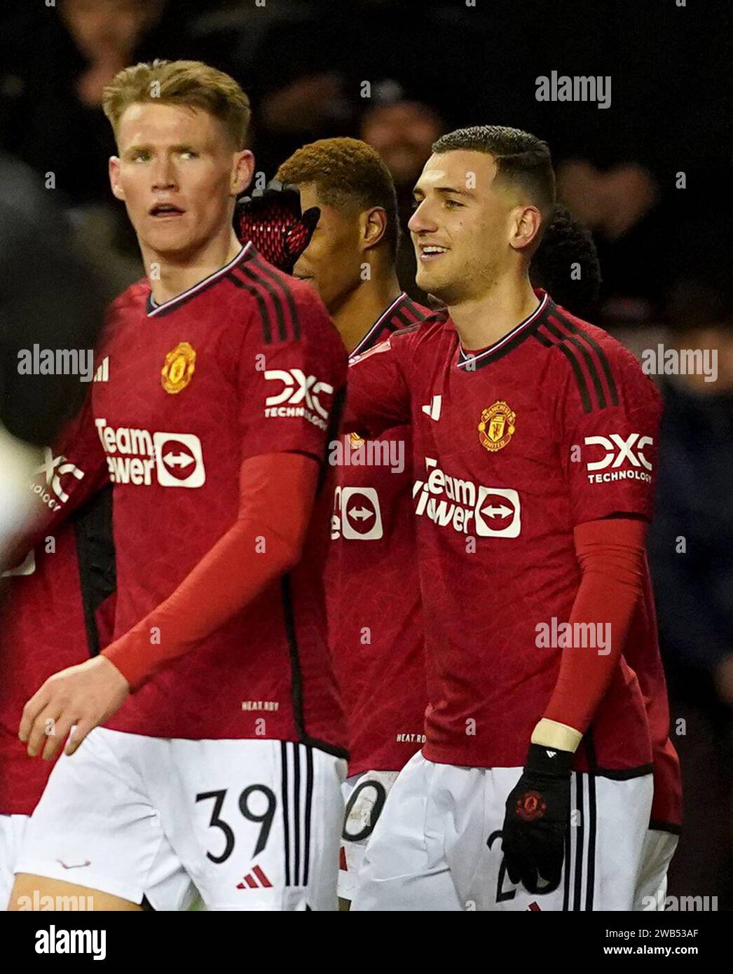 Manchester United's Diogo Dalot (right) celebrates scoring their side's ...
