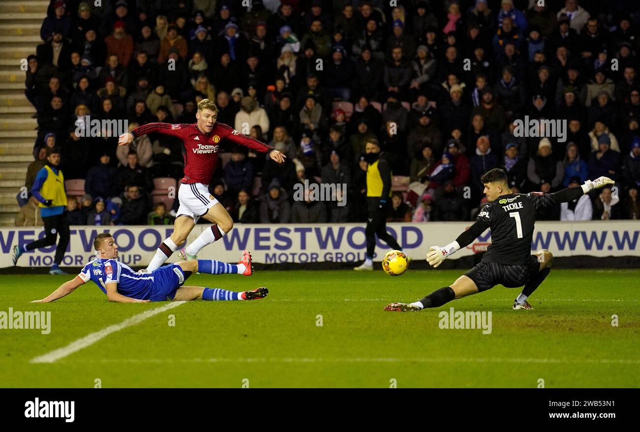 Manchester United's Rasmus Hojlund sees his shot saved by Wigan ...