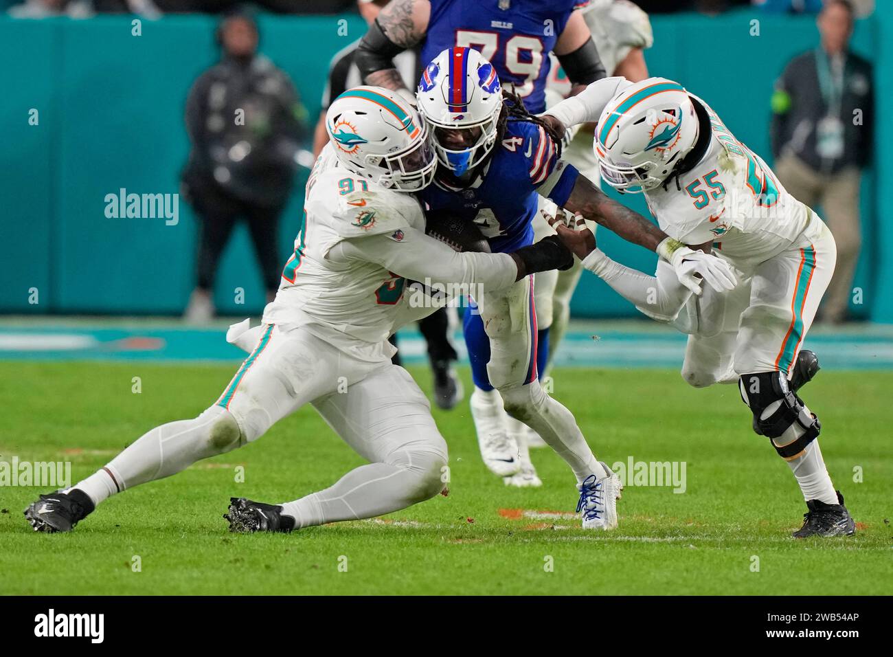 Miami Dolphins defensive end Emmanuel Ogbah (91) and linebacker Jerome ...