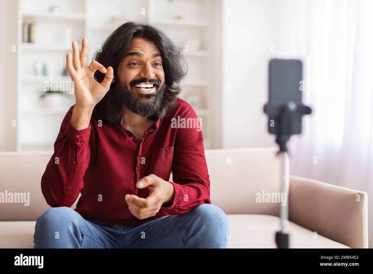Cool indian guy influencer streaming from home Stock Photo - Alamy