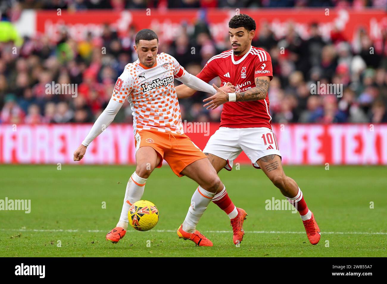 Oliver Norburn of Blackpool competes for the ball with Morgan Gibbs ...