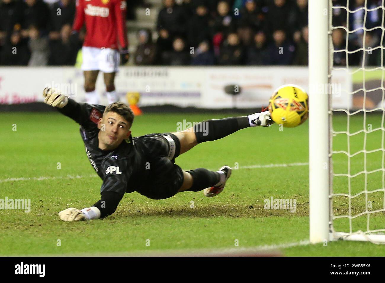 Wigan, UK. 08th Jan, 2024. Sam Tickle, the Wigan Athletic goalkeeper is ...