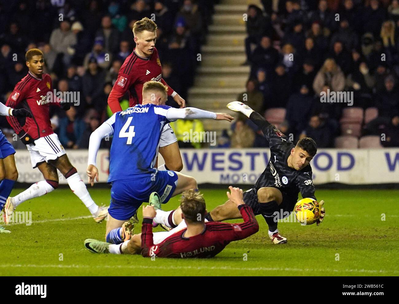 Manchester United's Scott McTominay sees his shot saved by Wigan ...