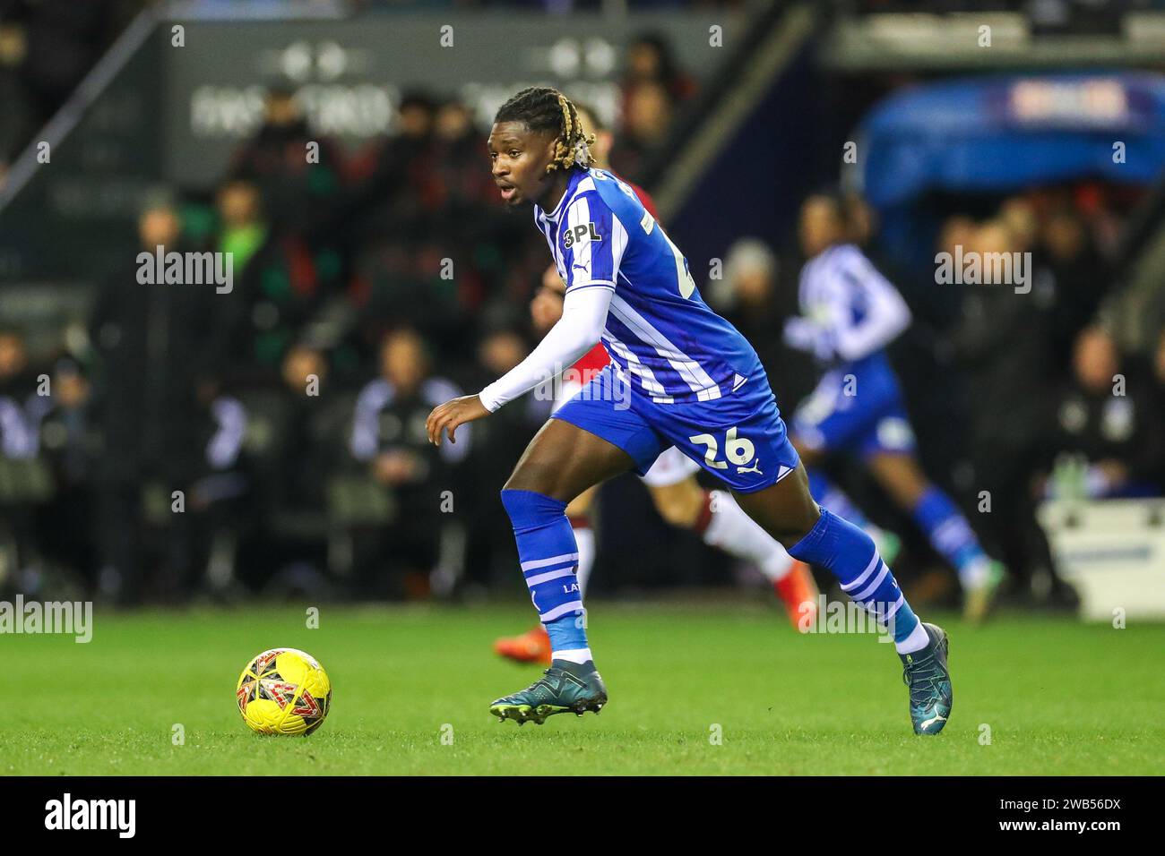 Wigan, UK. 08th Jan, 2024. Wigan Athletic midfielder Baba Adeeko (26 ...