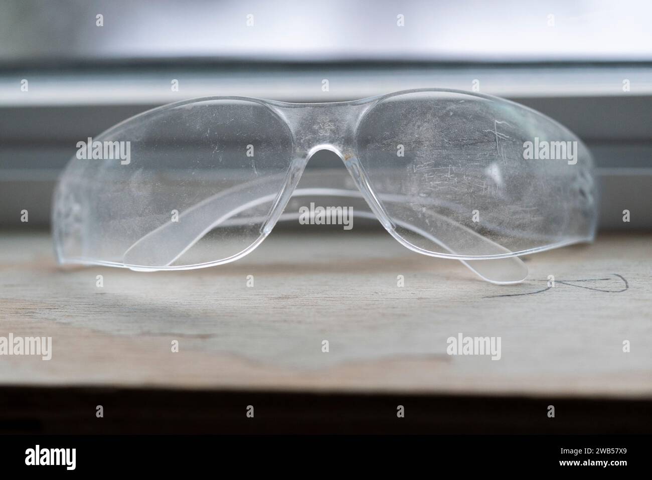 Safety glasses on window ledge at construction remodel job site Stock ...