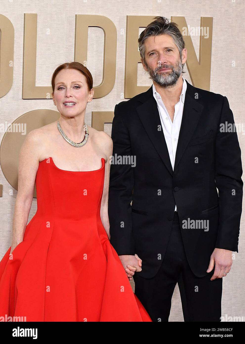 Beverly Hills, USA. 08th Jan, 2024. Bart Freundlich and Julianne Moore attend the 81st Annual ...