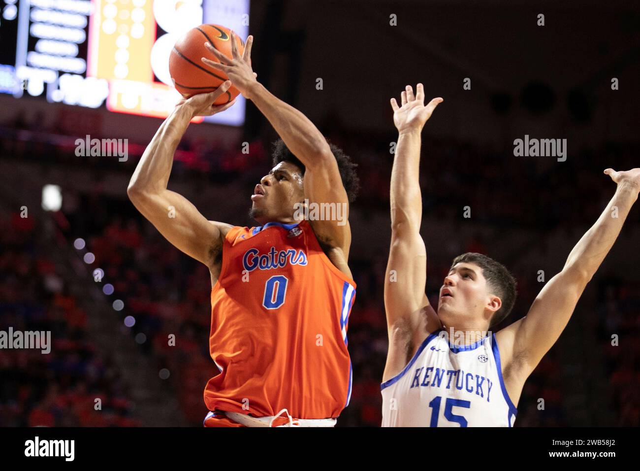 Florida guard Zyon Pullin (0) shoots under pressure from Kentucky guard Reed Sheppard (15 ...