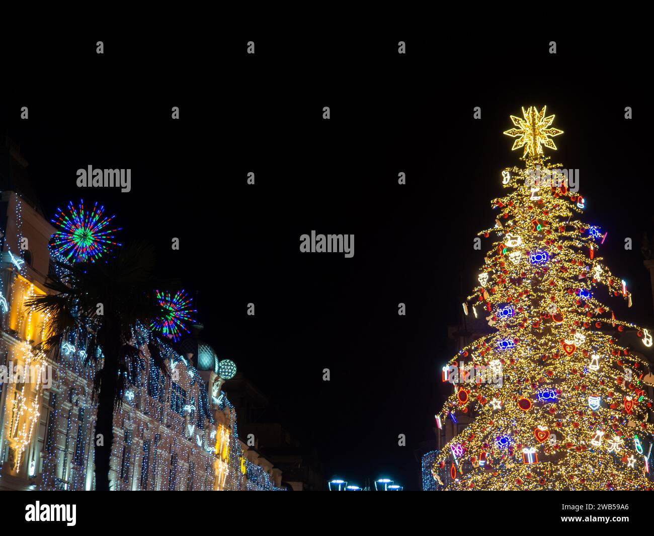 New Year tree on the city square. Lights on the street at night. City ...