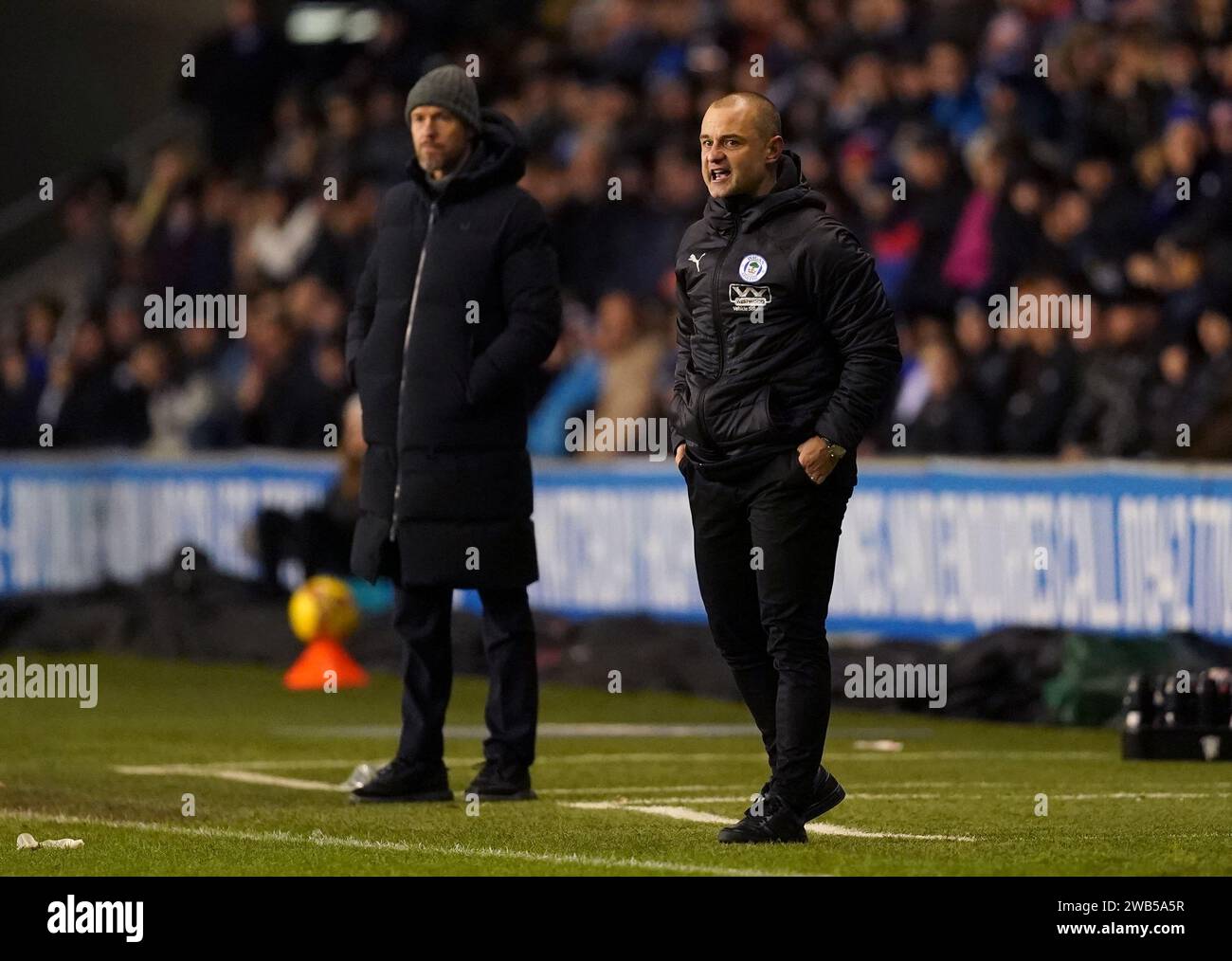 Wigan Athletic manager Shaun Maloney (right) and Manchester United ...