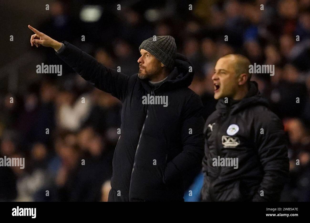Manchester United manager Erik ten Hag (left) and Wigan Athletic ...