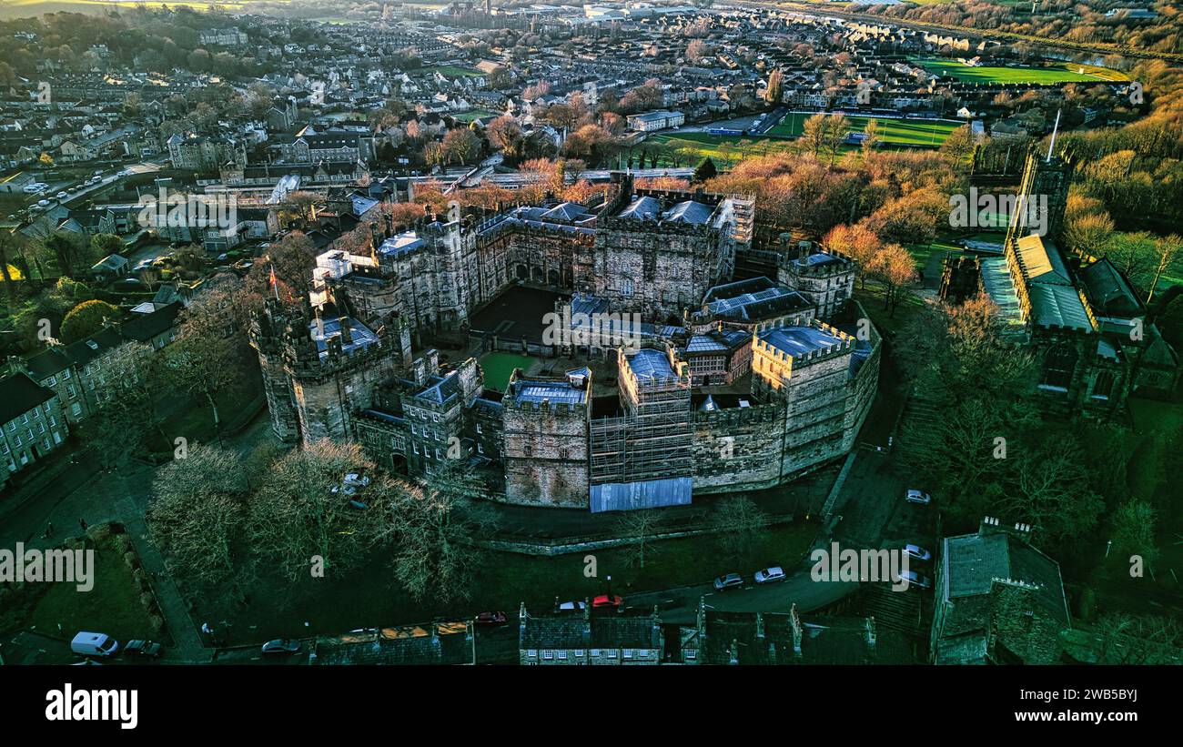 Aerial view of a historic Lancaster castle amidst a lush urban ...