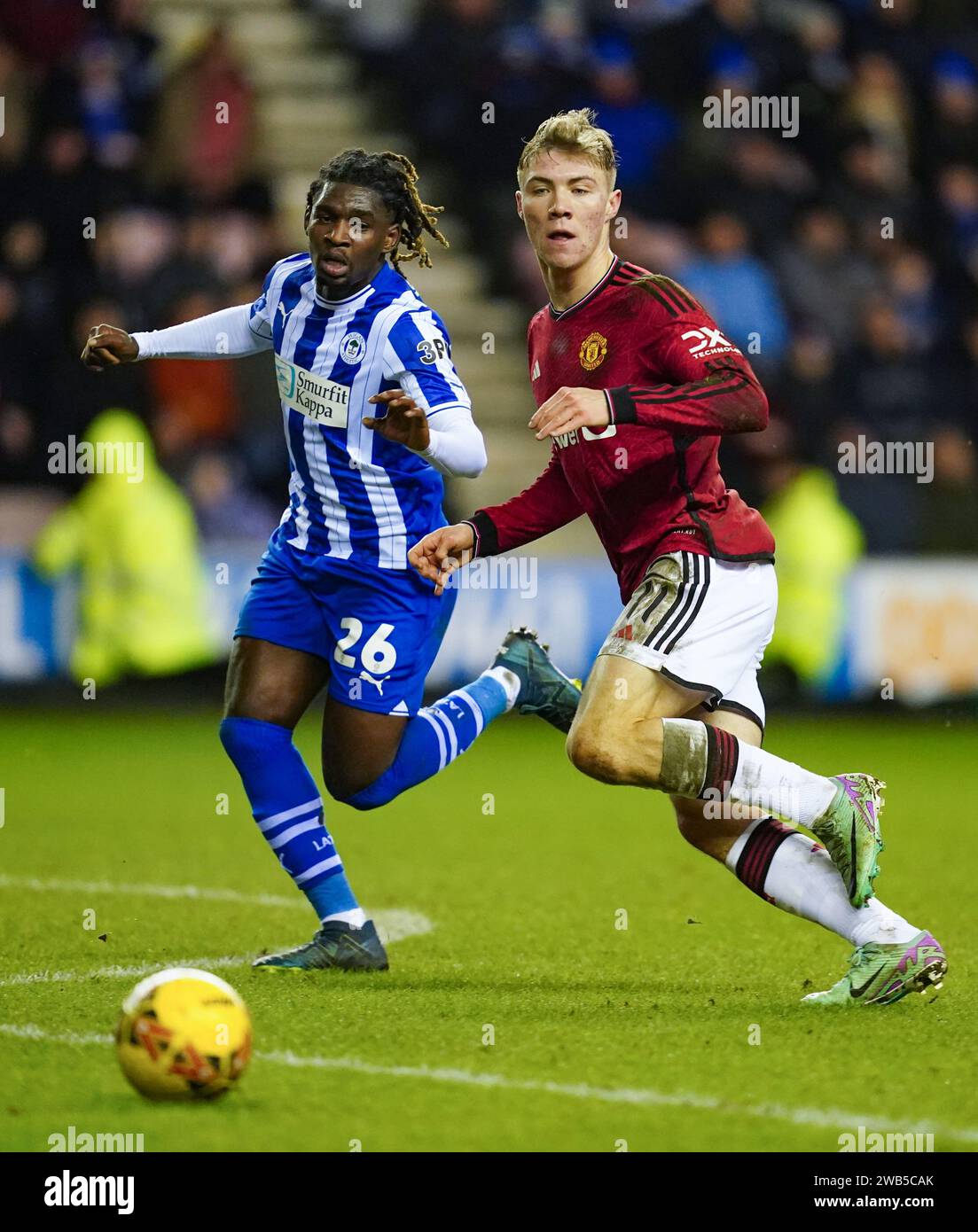 Wigan Athletic's Babajide Adeeko and Manchester United's Rasmus Hojlund ...