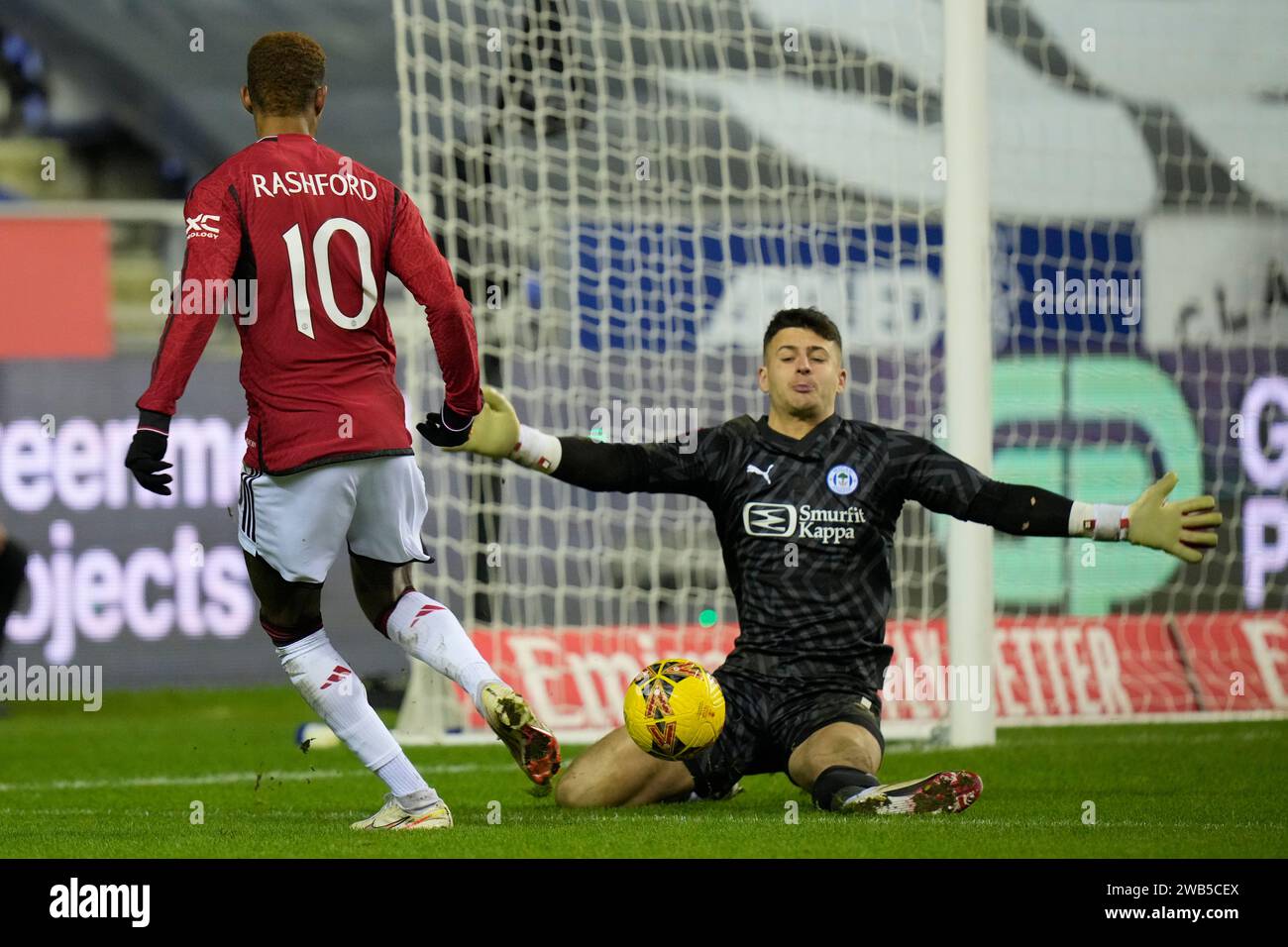 Wigan, UK. 08th Jan, 2024. Sam Tickle of Wigan Athletic saves a shot ...