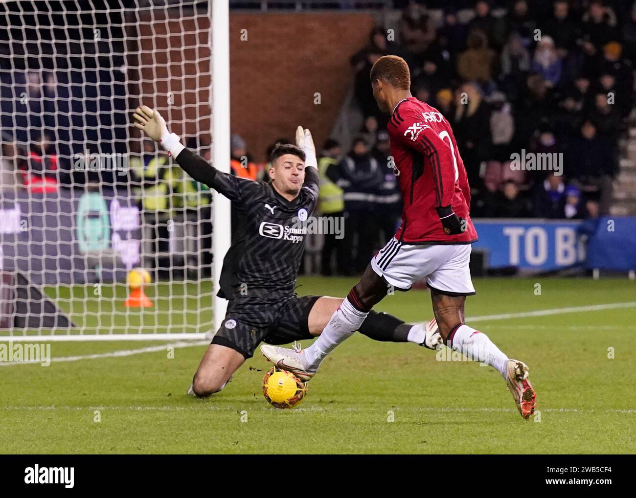Wigan, UK. 8th Jan, 2024. Sam Tickle of Wigan Athletic makes a save ...