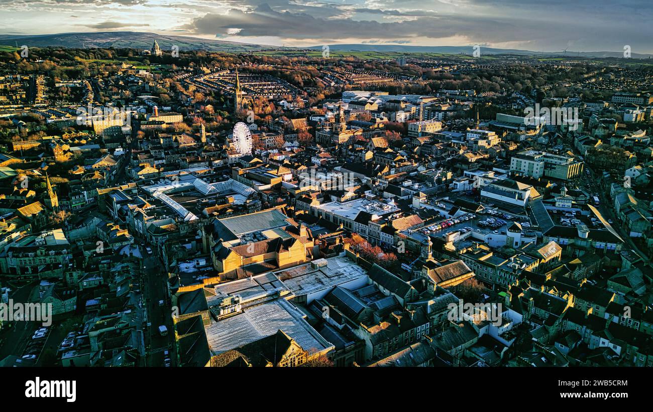 Aerial view of a city Lancaster at sunset with warm lighting ...