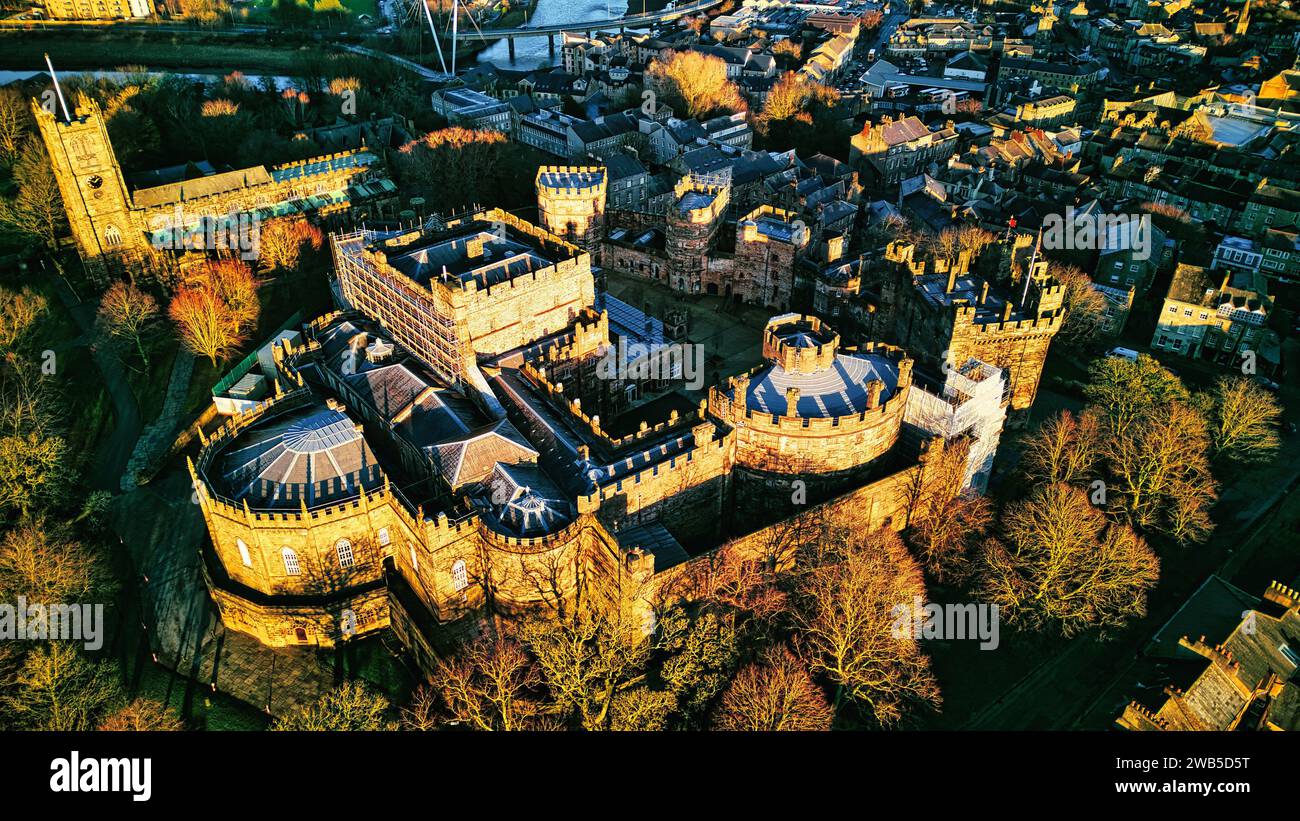 Aerial view of a majestic medieval Lancaster castle at sunset, with ...