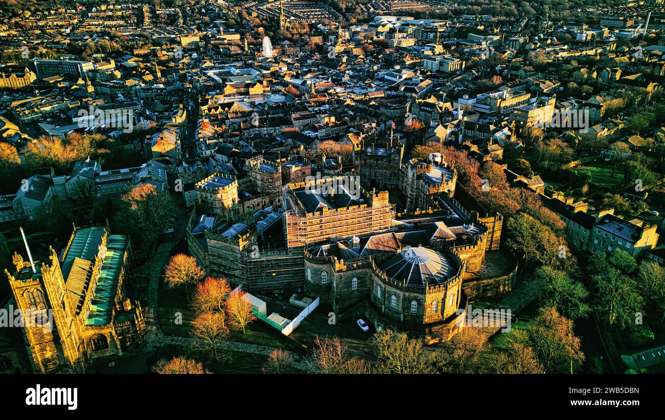 Aerial view of a historic Lancaster castle amidst a sprawling cityscape ...