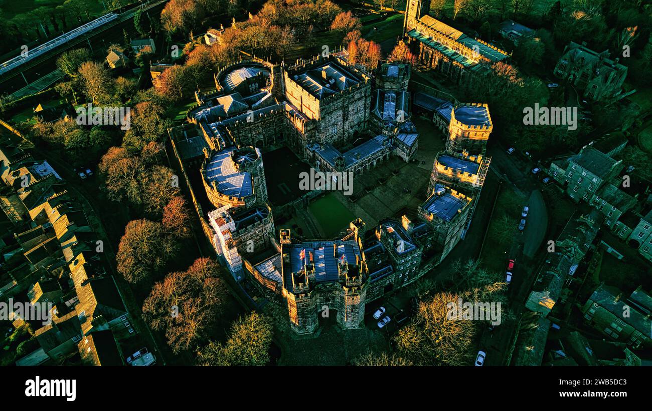 Aerial view of a majestic Lancaster castle surrounded by lush trees ...