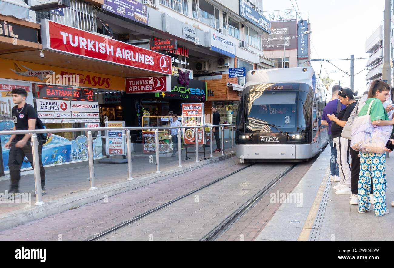 Tram stop Muratpasa, rail travel, commuters, tourists people at tramway ...