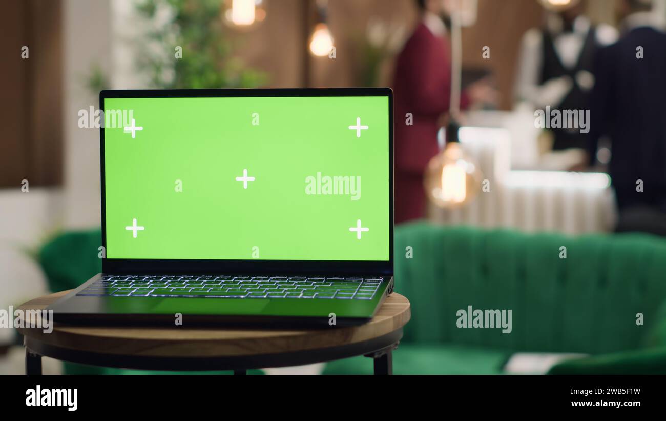 At front desk is a device with isolated greenscreen layout, guests ...
