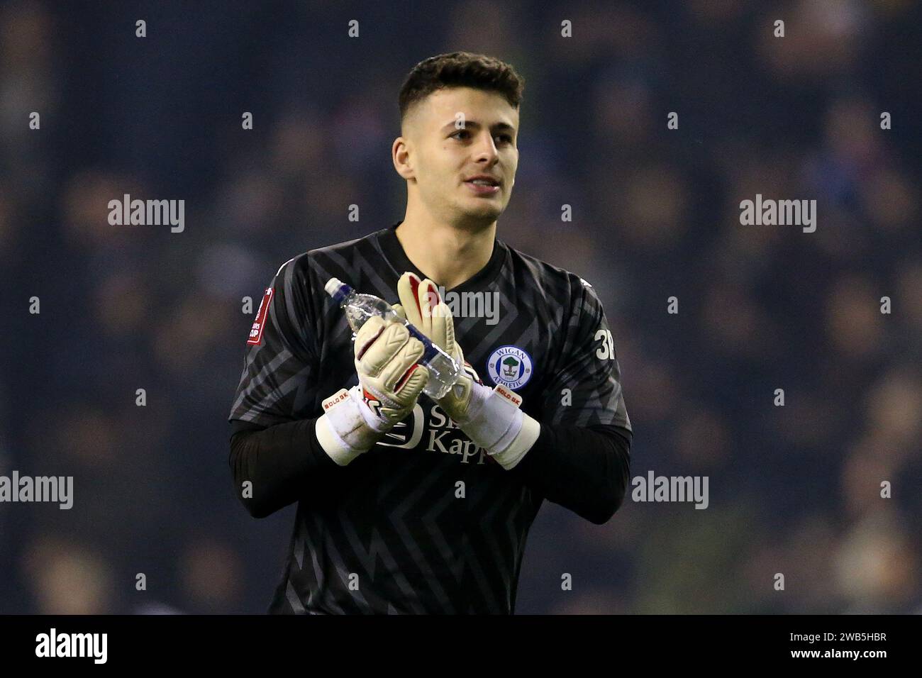 Wigan, UK. 08th Jan, 2024. Sam Tickle, the Wigan Athletic goalkeeper ...